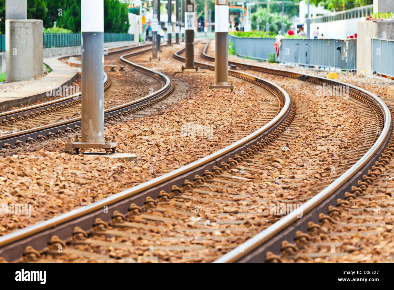 Railway on the road Stock Photo - Alamy