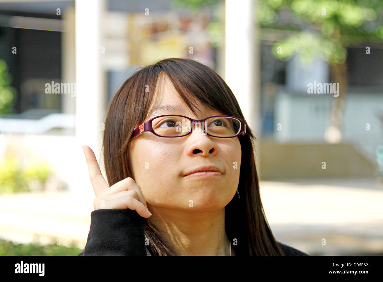 Asian woman with a idea Stock Photo - Alamy
