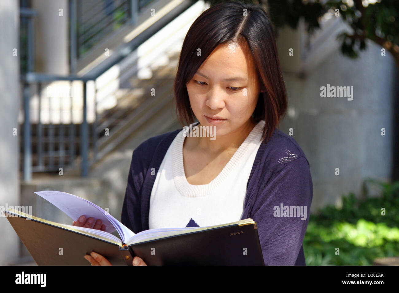 Asian girl studying in university Stock Photo - Alamy