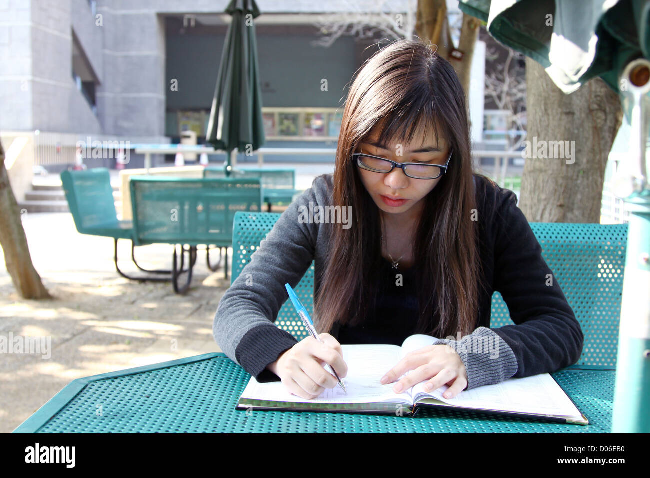 Asian girl studying in university Stock Photo - Alamy