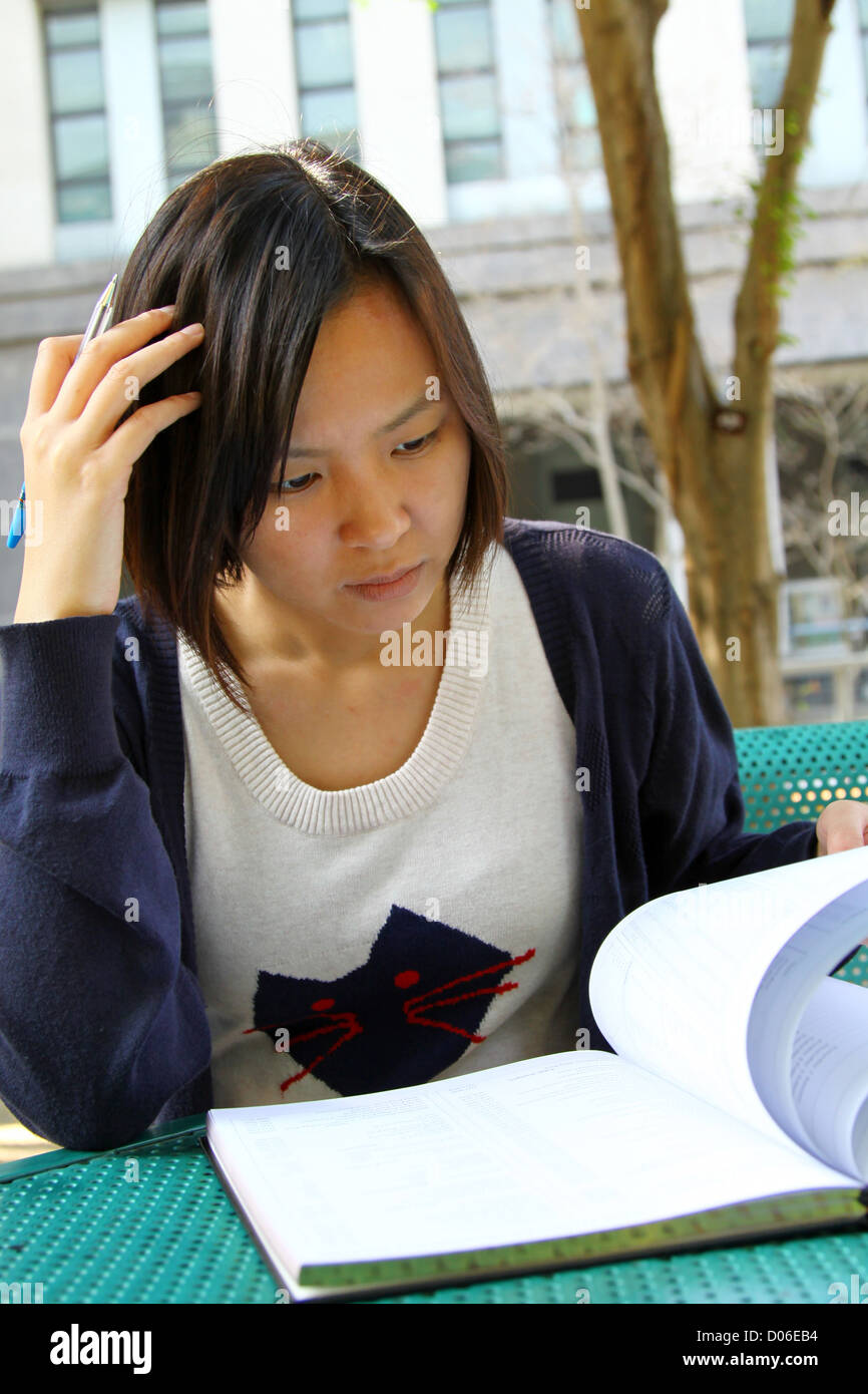 Asian girl studying in university Stock Photo - Alamy