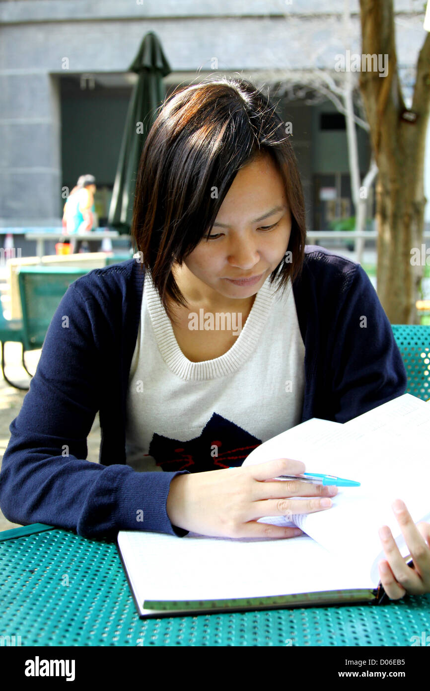 Asian girl studying in university Stock Photo - Alamy