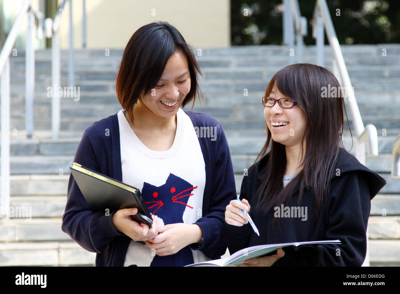 Asian students studying and discussing in university Stock Photo - Alamy