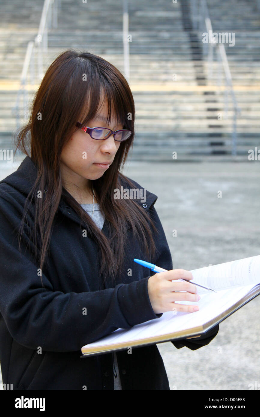 Asian girl studying in university Stock Photo - Alamy
