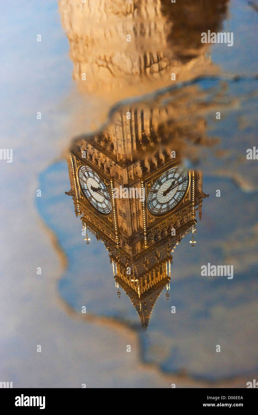 Big Ben reflected in a pavement puddle,the iconic landmark in London ...