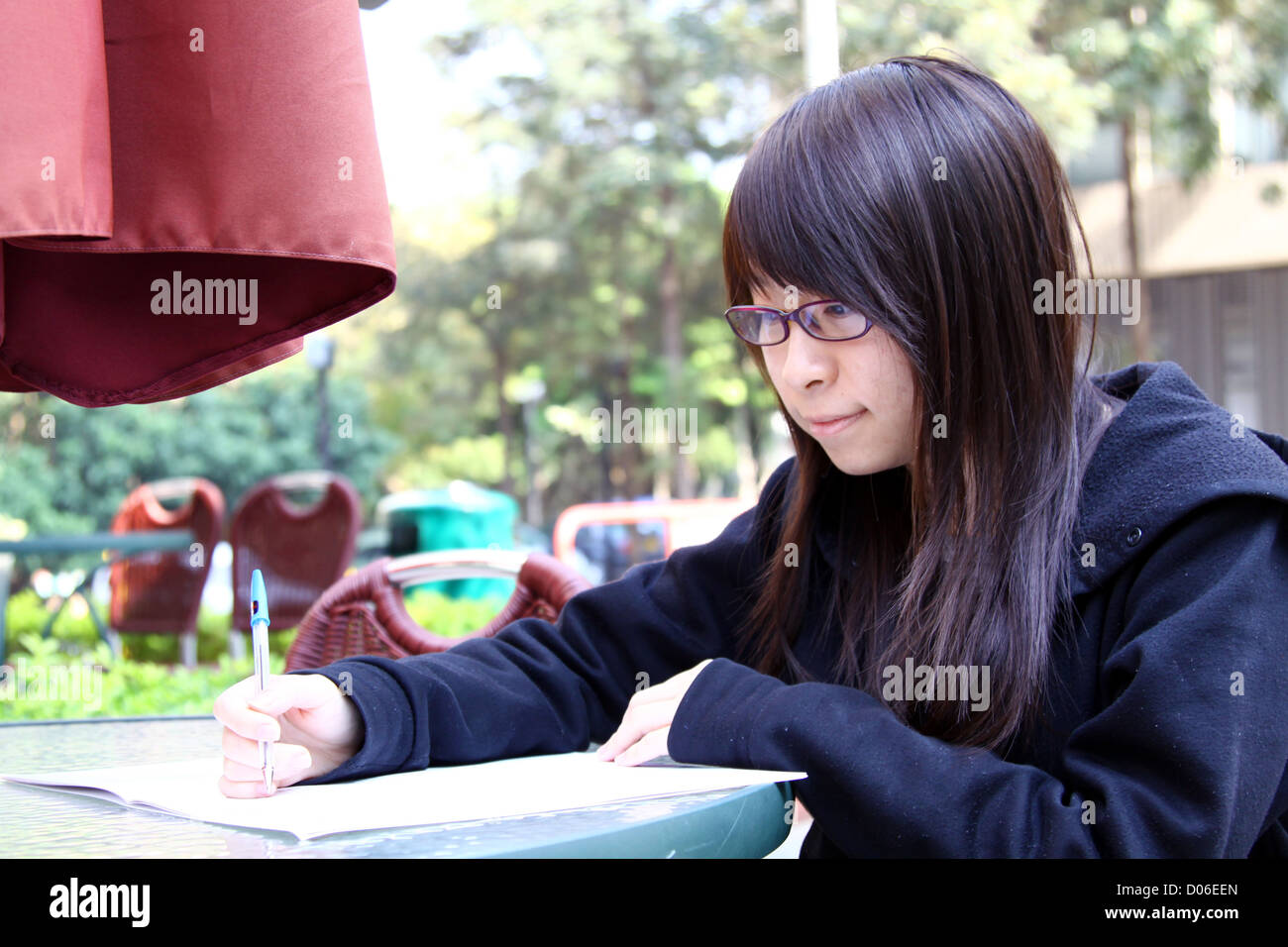 Asian girl studying in university Stock Photo - Alamy