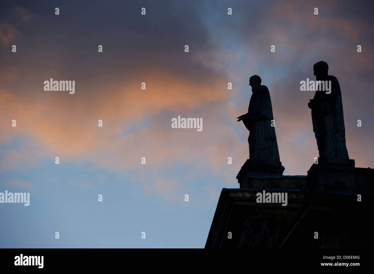 The statues on Queens College front,in the autumn sunset Stock Photo ...