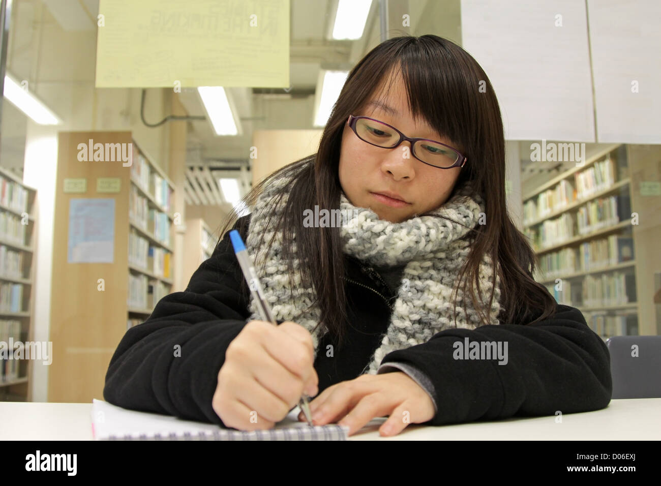 Asian woman studying hard in a university Stock Photo - Alamy
