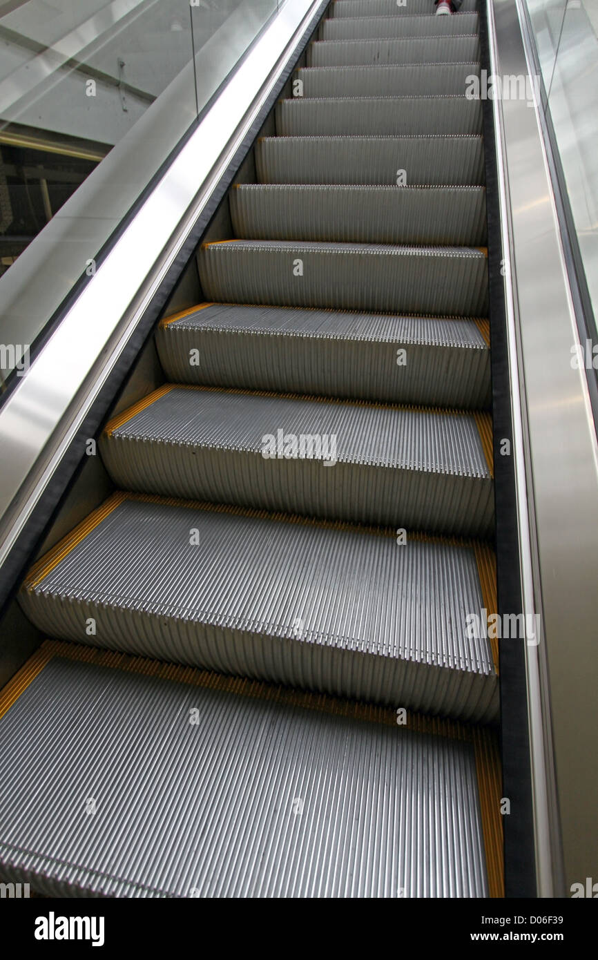 Moving escalator in subway station Stock Photo - Alamy
