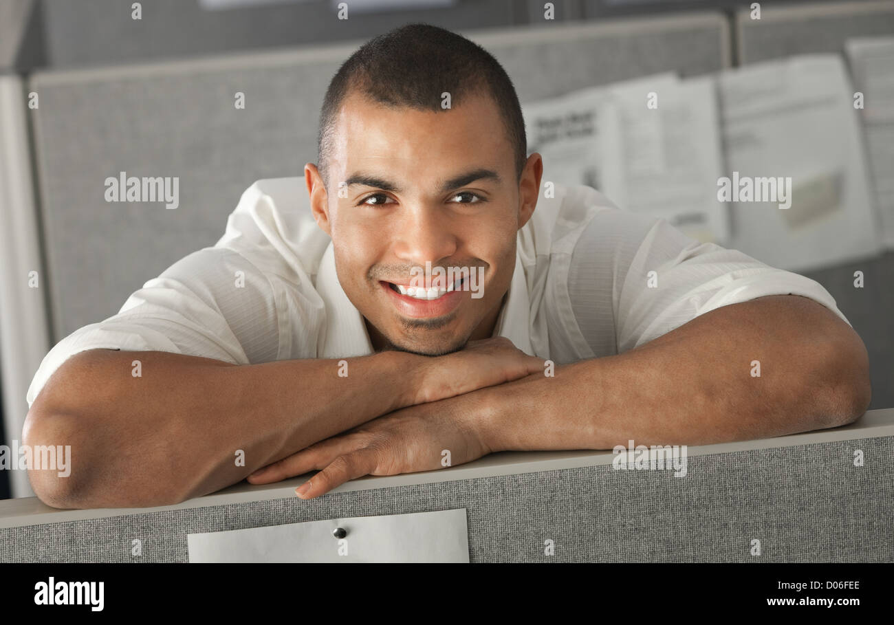 Confident office worker rests his chin on his arms Stock Photo - Alamy