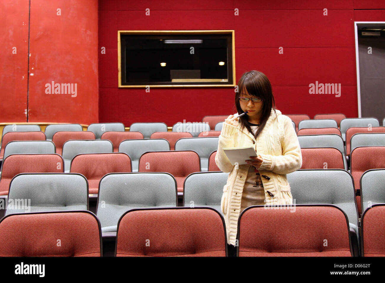 Asian student in lecture hall Stock Photo - Alamy