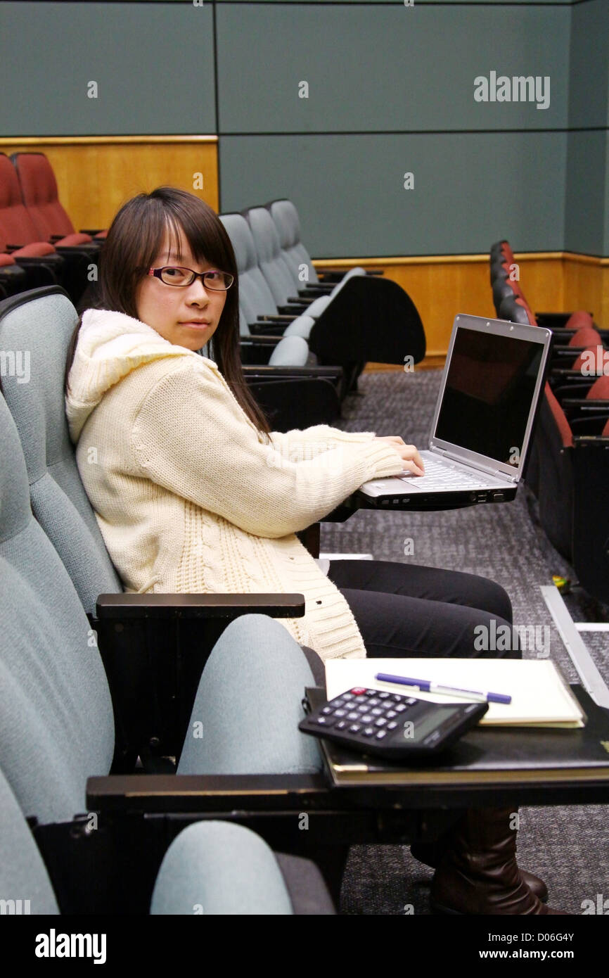 Asian university student using laptop and studying Stock Photo - Alamy