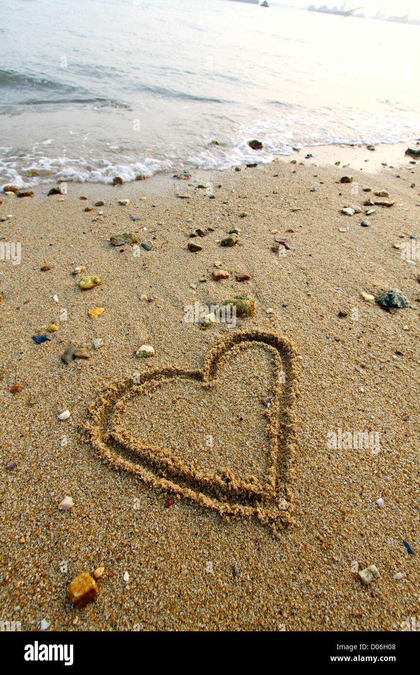 Heart on sand Stock Photo - Alamy