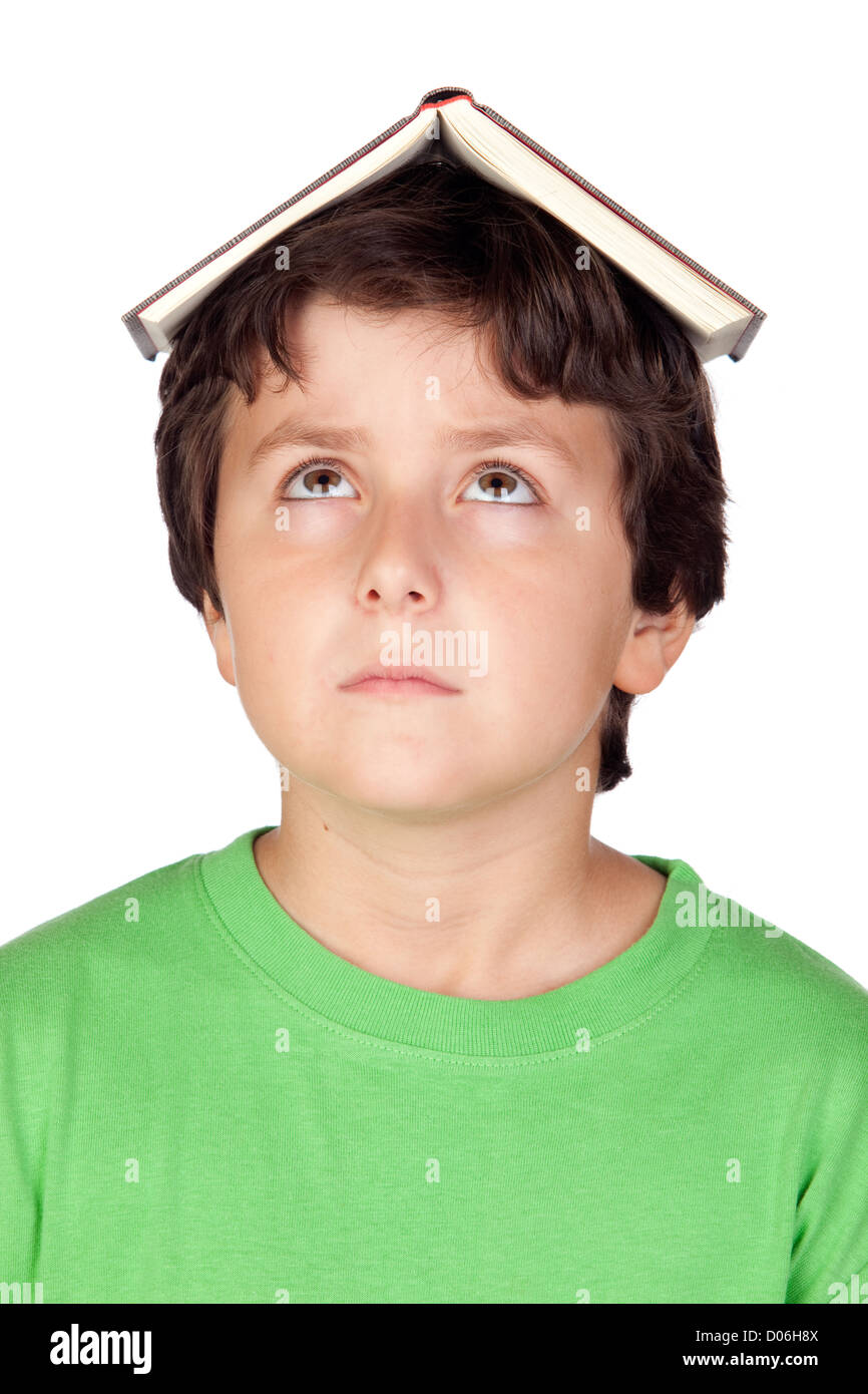 Student child with a book on his head isolated over white background ...