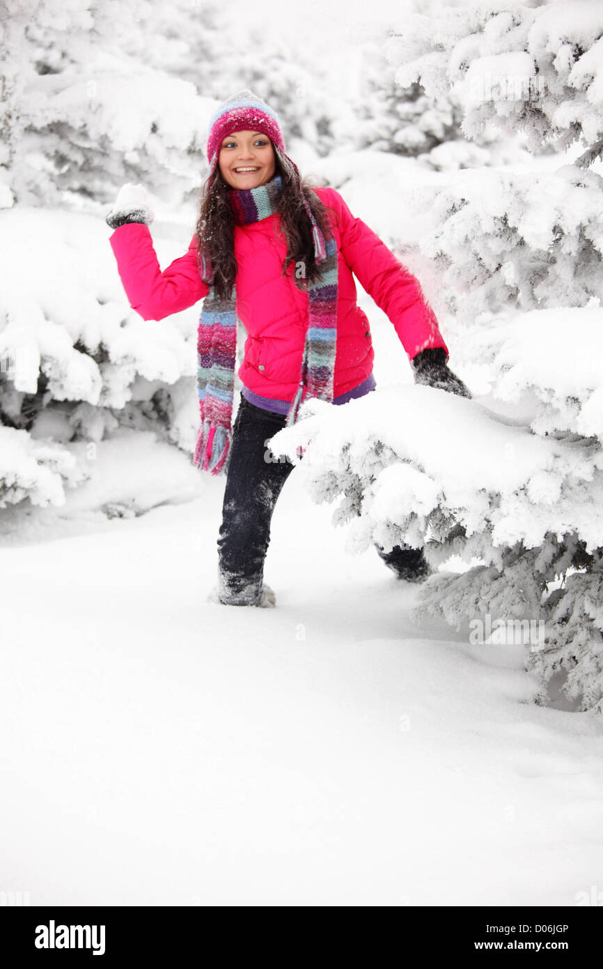 winter woman play snowballs on snow background Stock Photo - Alamy