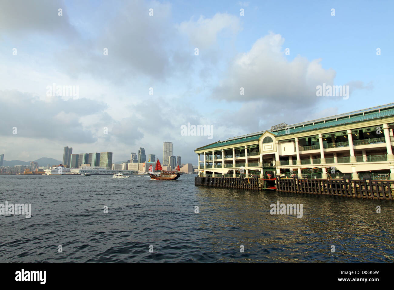 Hong Kong Ferry Pier and junk boat Stock Photo - Alamy