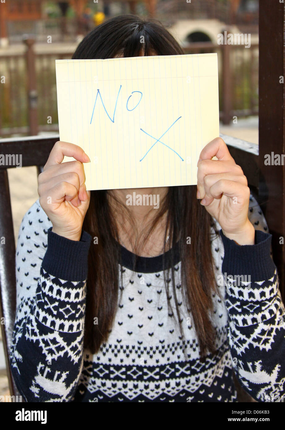 Woman holding NO signage Stock Photo - Alamy