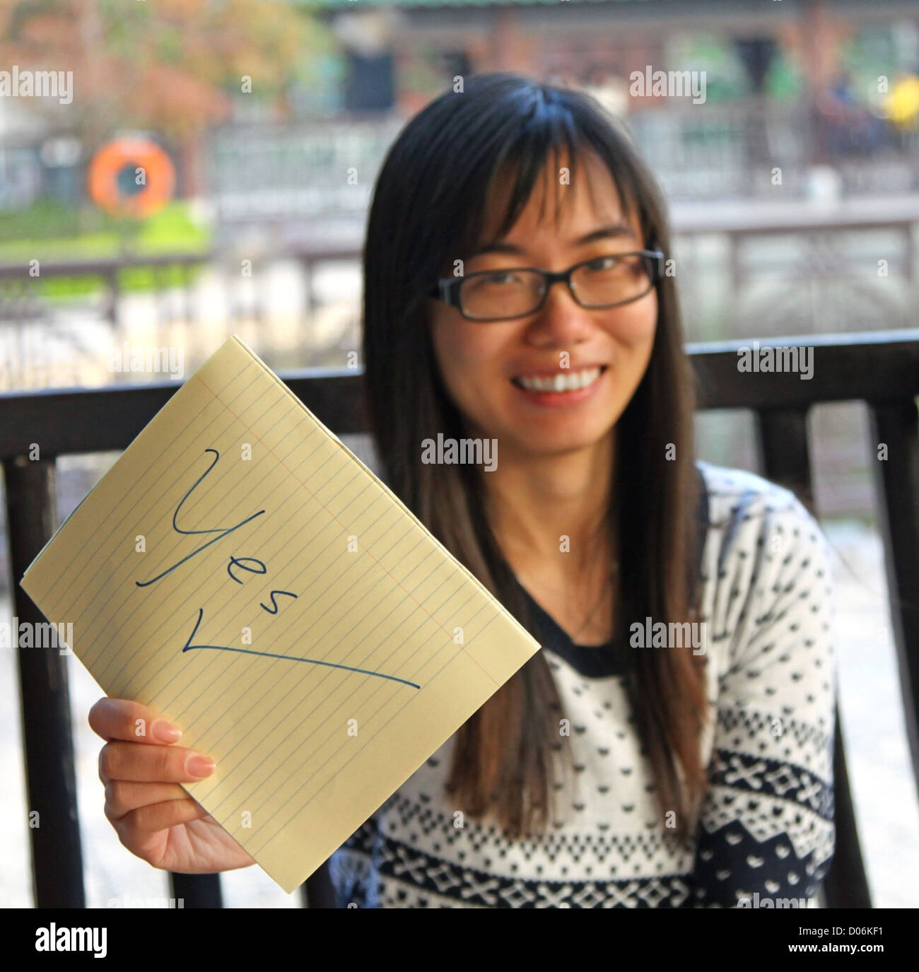Asian woman with YES sign Stock Photo - Alamy