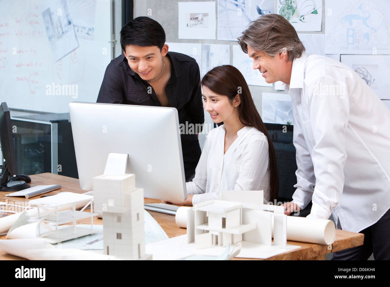 Architects working before computer in studio Stock Photo - Alamy