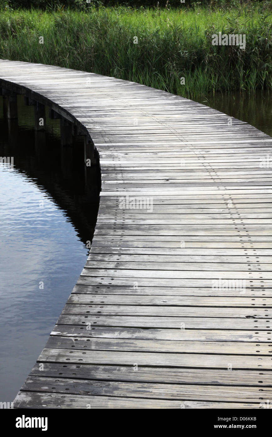 A wooden path in wetland park Stock Photo - Alamy