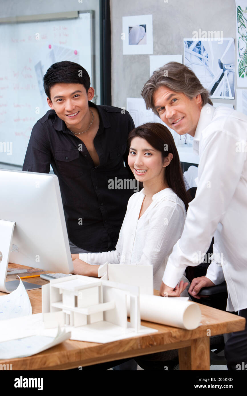 Architects working before computer in studio Stock Photo - Alamy
