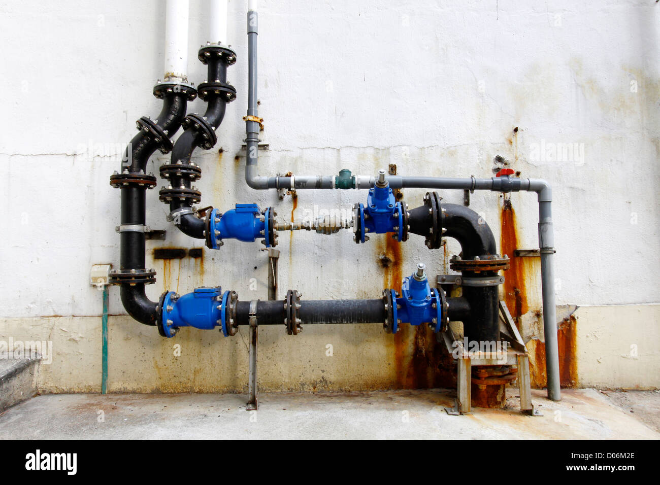 Rusted water pipes in a housing estate Stock Photo - Alamy