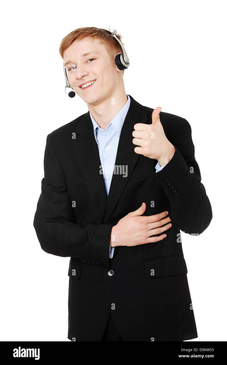 Charming customer service representative with headset on gesturing OK ...