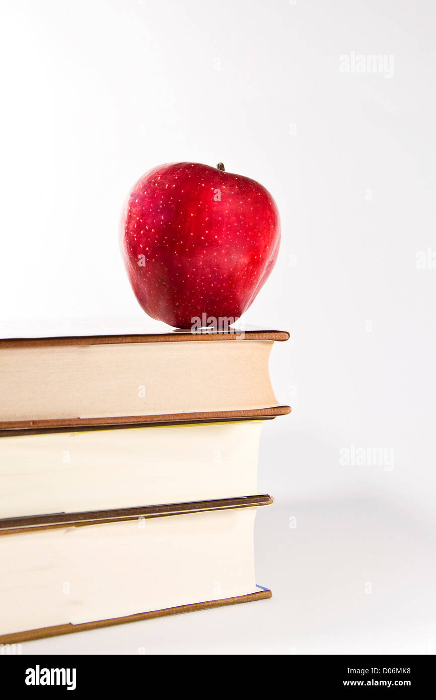 Red apple on top of a stack of books Stock Photo - Alamy