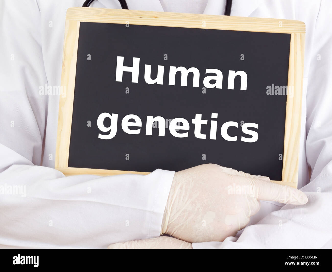 Doctor shows information on blackboard: human genetics Stock Photo - Alamy