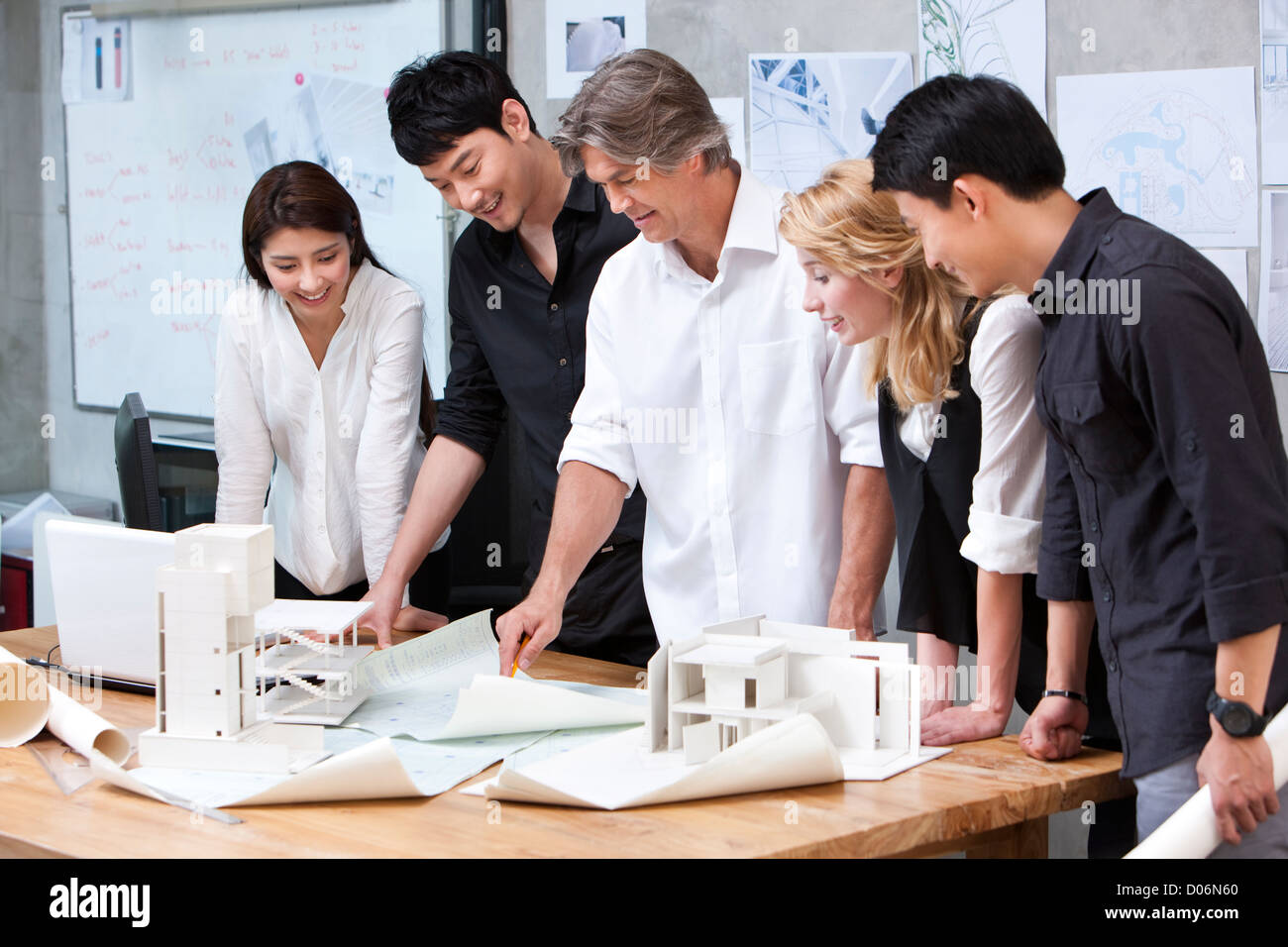 Architects team working in studio Stock Photo - Alamy