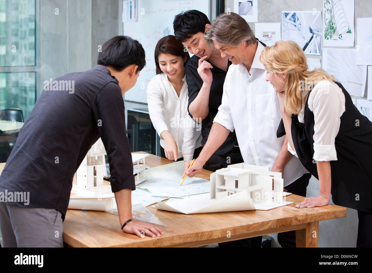 Architects working in studio Stock Photo - Alamy