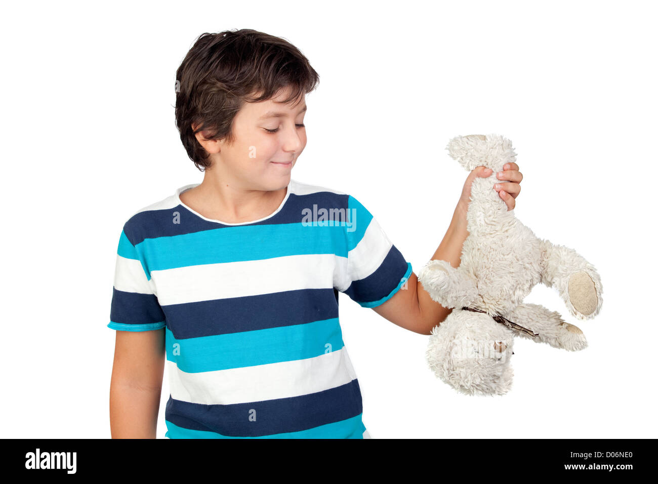 Adorable boy picking up a teddy bear isolated on white background Stock ...