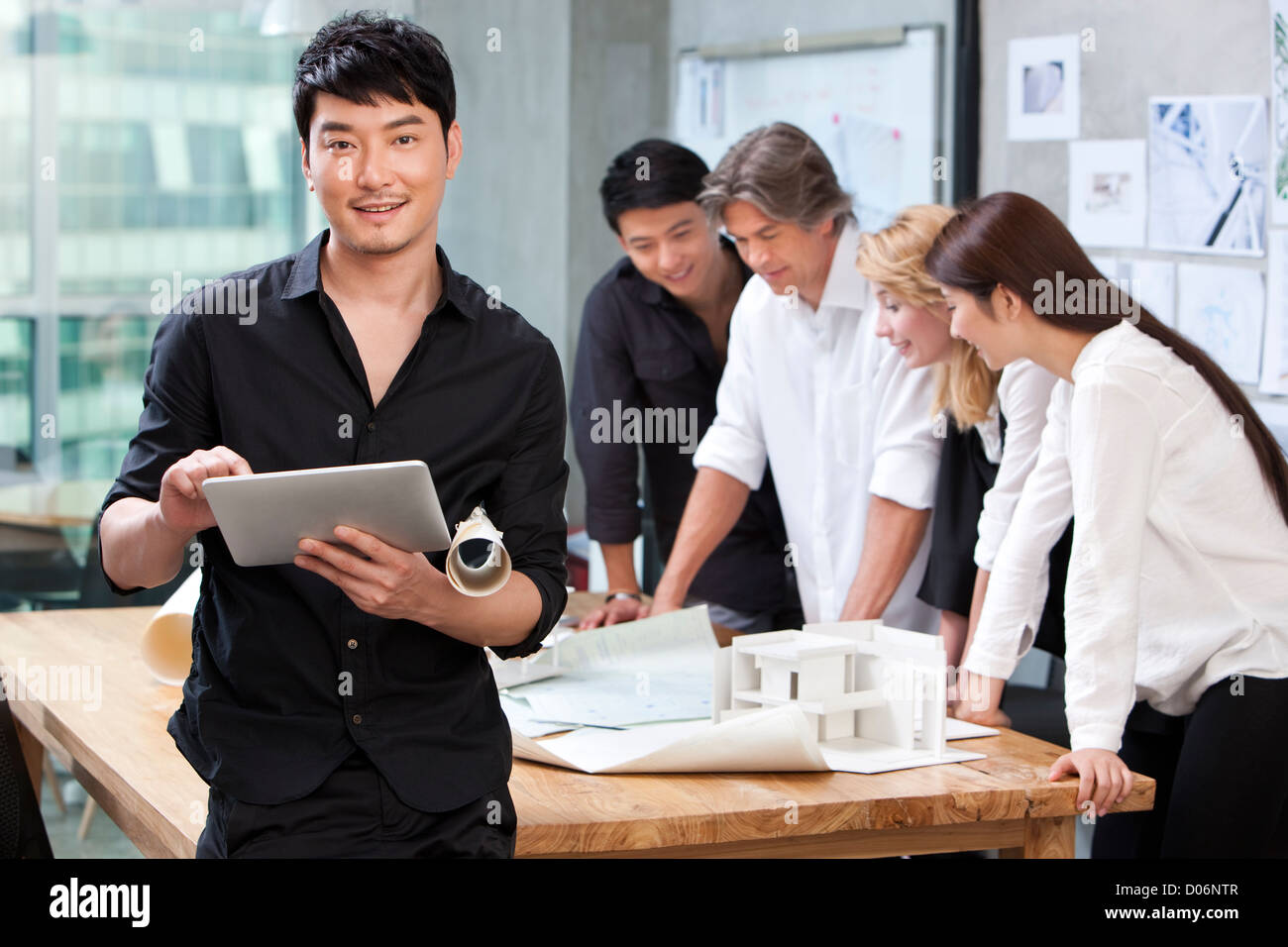 Architect using digital tablet in studio Stock Photo - Alamy