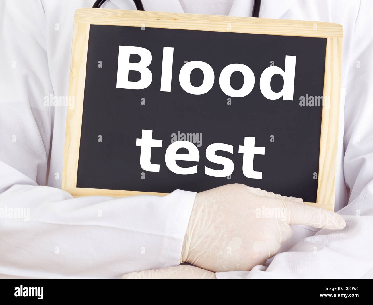 Doctor shows information on blackboard: blood test Stock Photo - Alamy