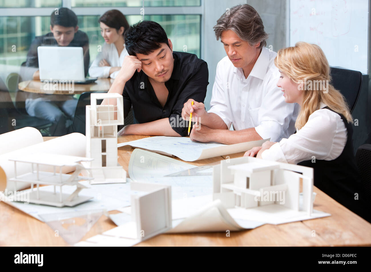 Architects studying a blueprint Stock Photo - Alamy