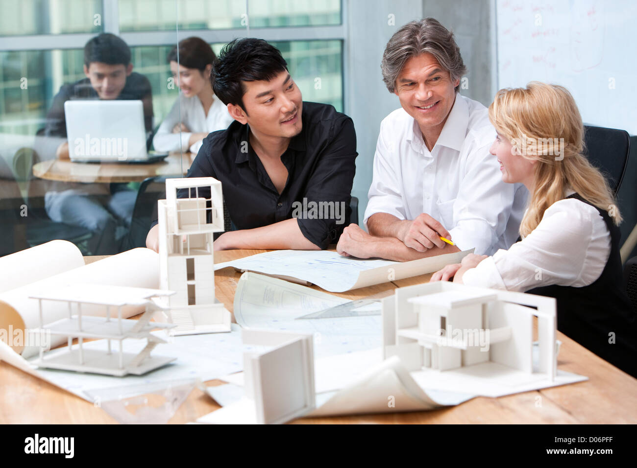 Architects studying a blueprint Stock Photo - Alamy