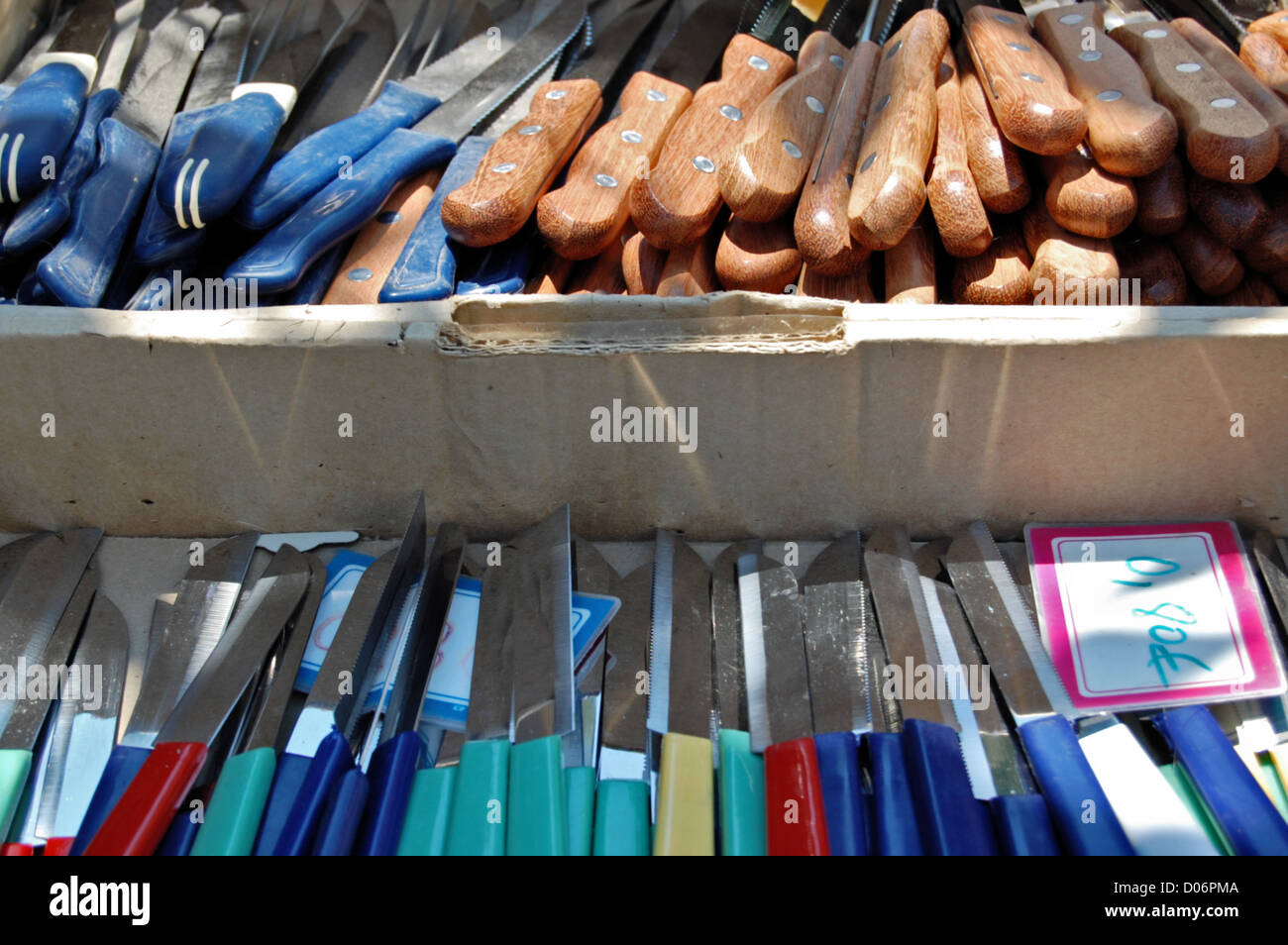Variety of cheap knives for sale on street market Stock Photo - Alamy