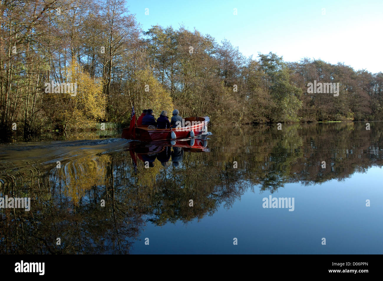 Traditional wooden motor boat on the River Bure between Belaugh and ...