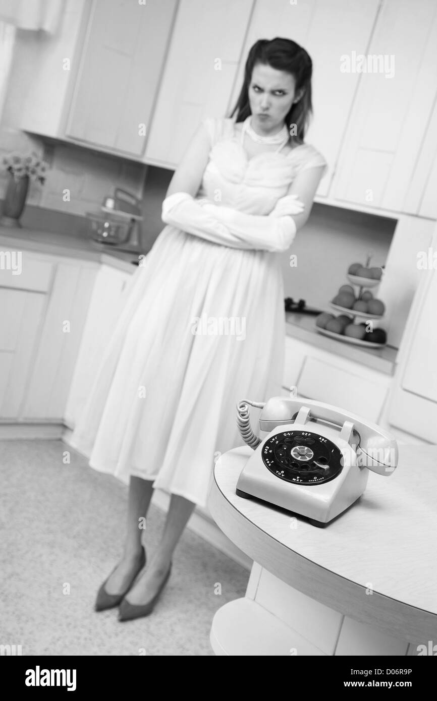 Unhappy cute young woman bride waiting by telephone Stock Photo - Alamy