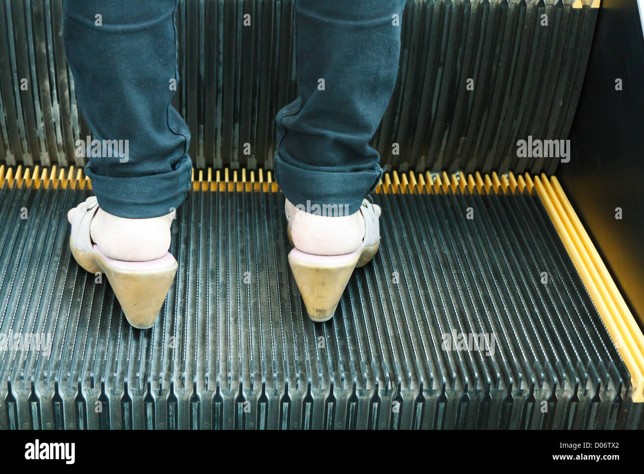 Shoes on escalator hi-res stock photography and images - Alamy