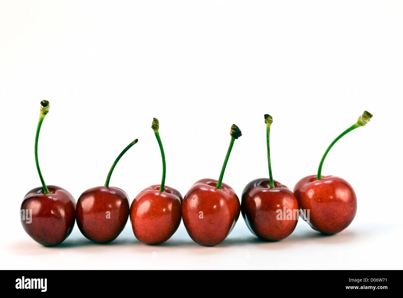 a line of cherries Stock Photo - Alamy