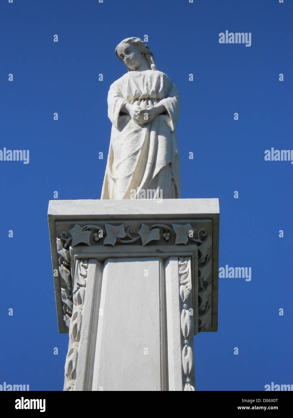 A statue crowns the Arsenal Monument at the Congressional Cemetery in ...