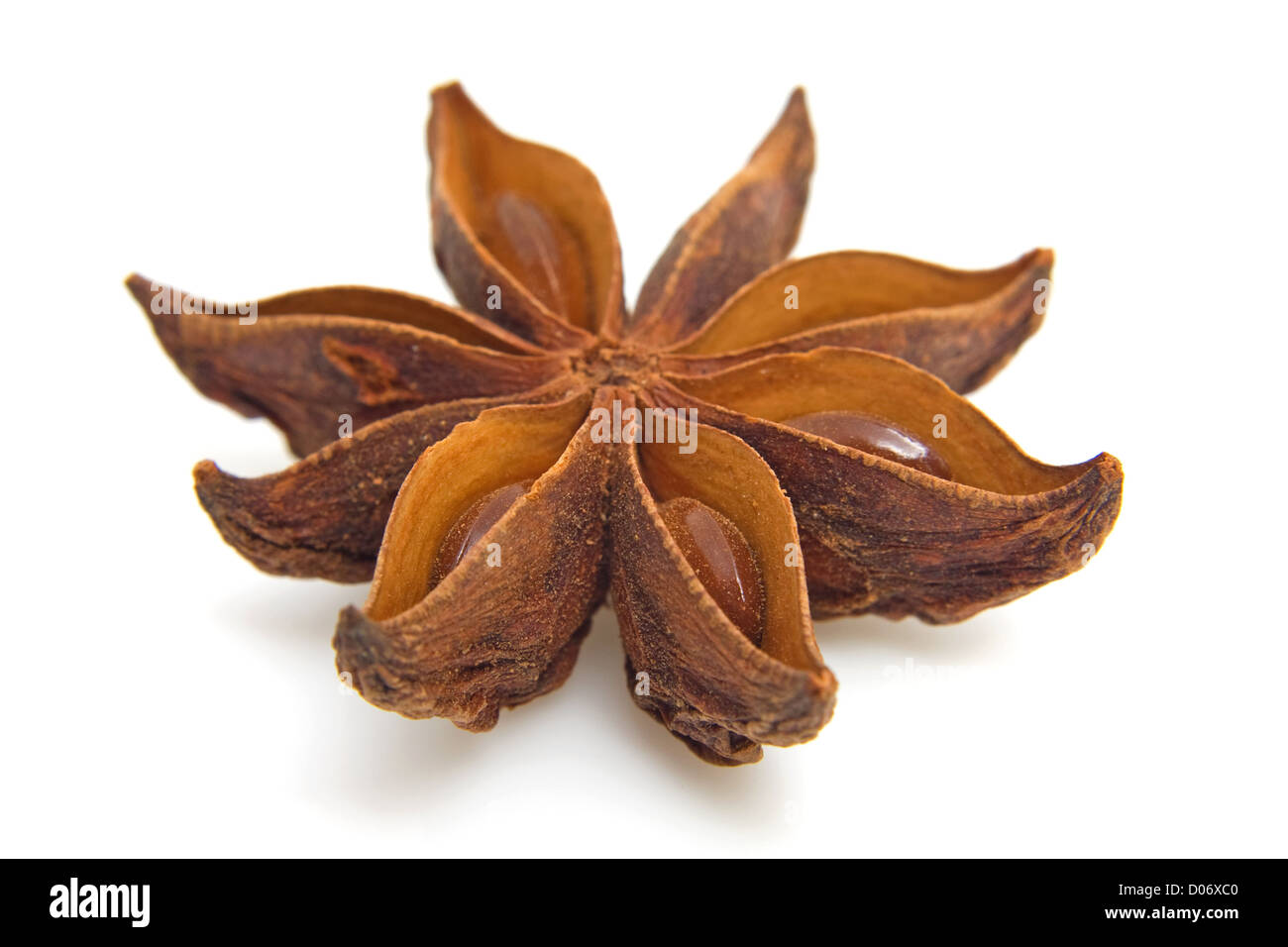 whole star anise in closeup over white background Stock Photo - Alamy