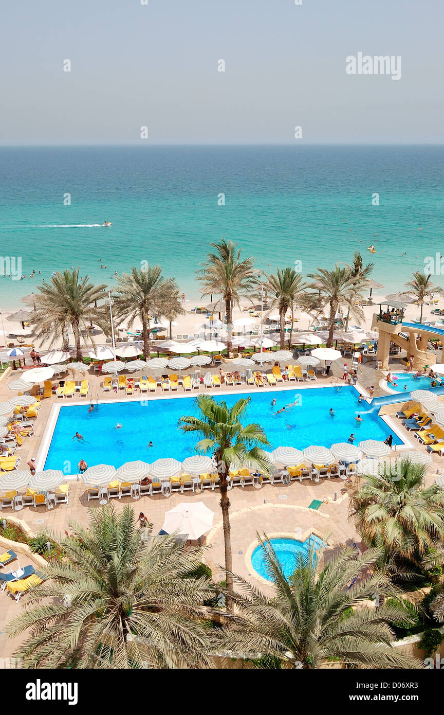 Swimming pool near beach at luxury hotel, Sharjah, UAE Stock Photo - Alamy
