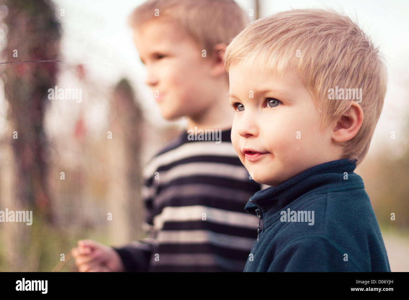 Boys standing together outside Stock Photo - Alamy