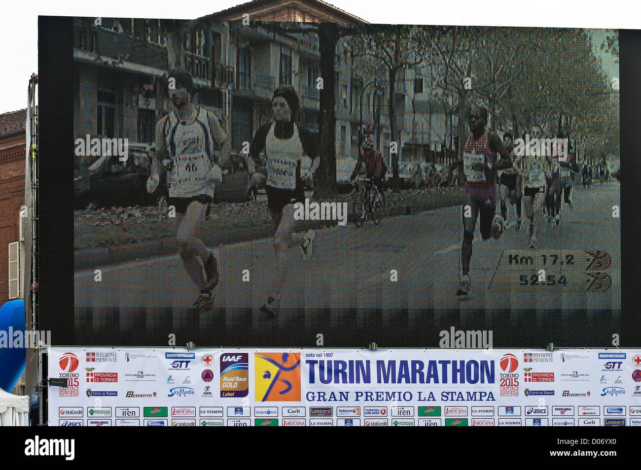 marathon runners in a great screen during the Turin marathon 2012 ...