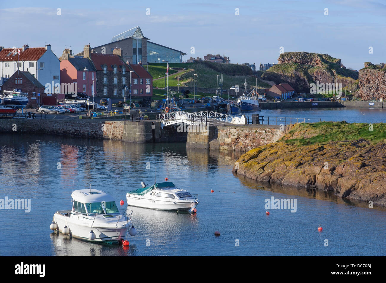 View across the old harbour to the town and modern swimming pool ...