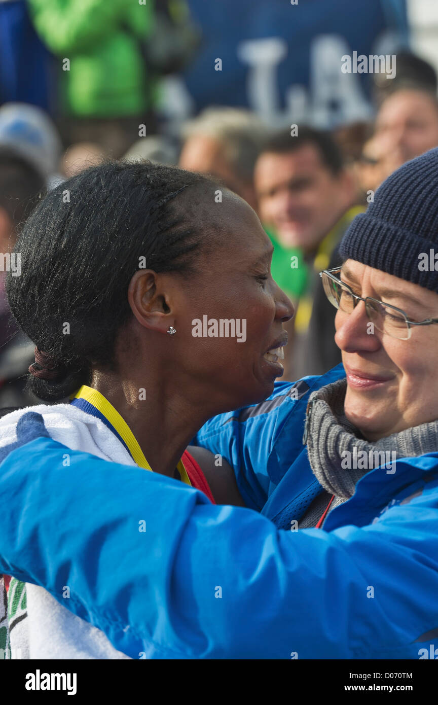 the Kenyan marathon runner Sharon Cherop embraced after her victory of ...