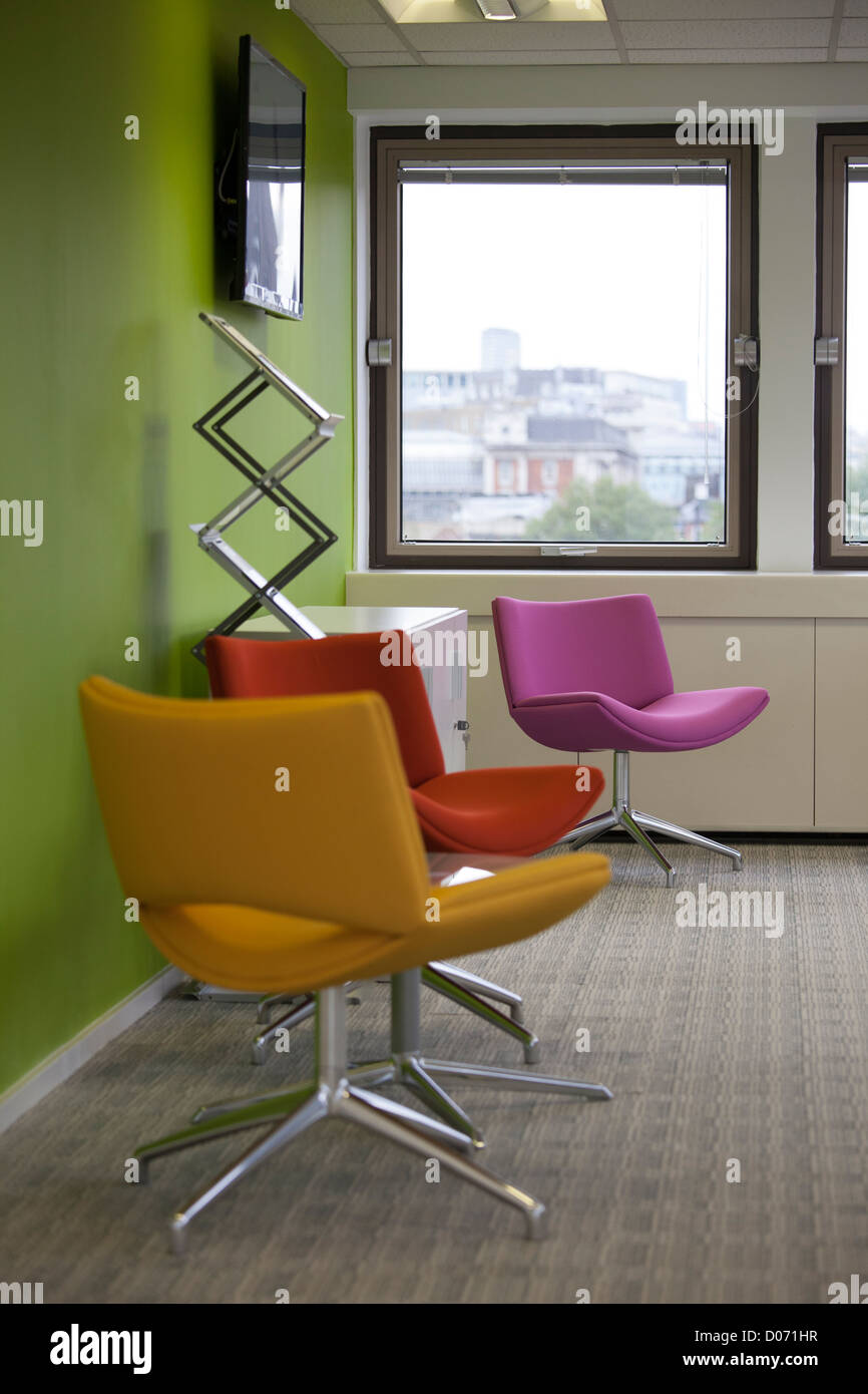 Multi-Coloured Chairs in Modern Office Stock Photo - Alamy