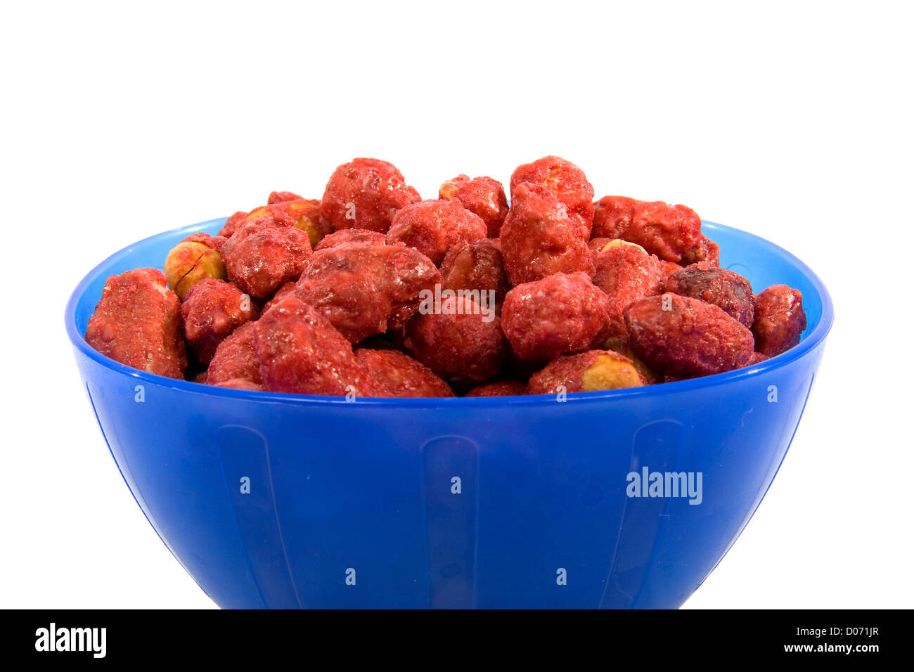Blue bowl with sugared peanuts over white background Stock Photo - Alamy